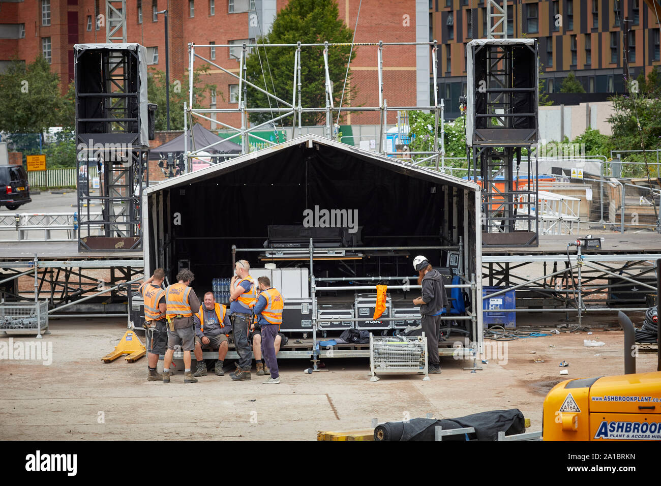 Manchester stage riggers resting on the sound desk Stock Photo - Alamy