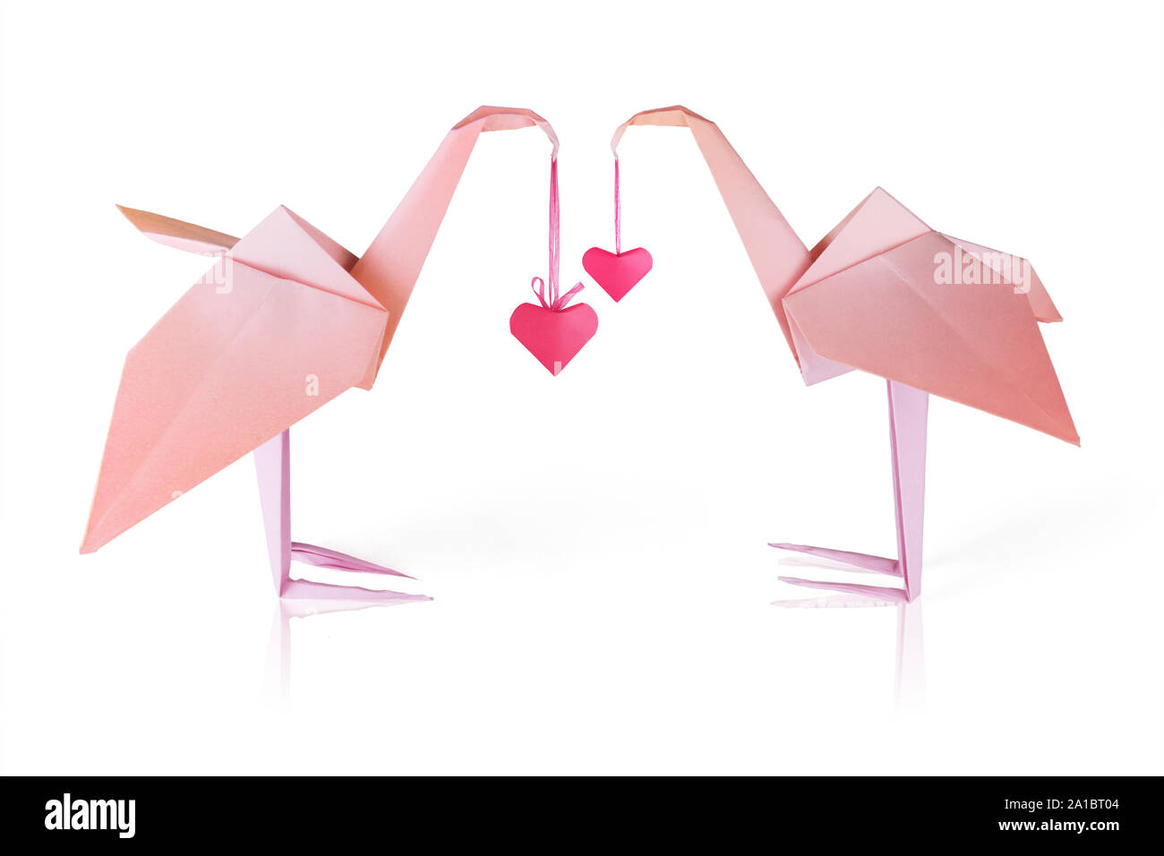 Origami pink paper flamingo couple Stock Photo - Alamy