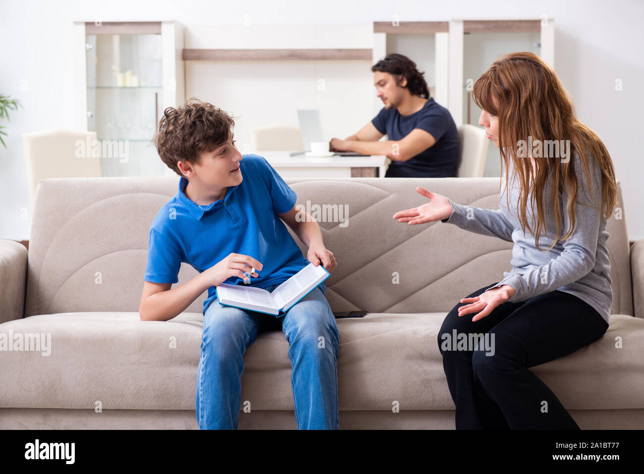 The concept of underage smoking with young boy and family Stock Photo ...