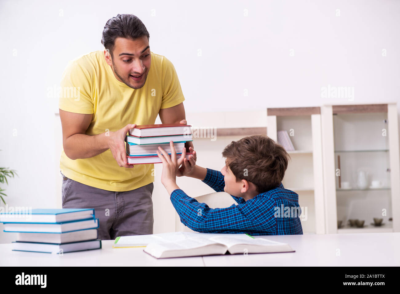 The father helping his son to prepare for school Stock Photo - Alamy