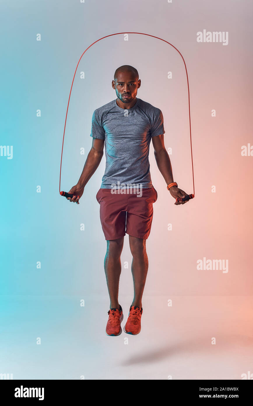 Staying fit. Full length of young african man in sport clothing ...