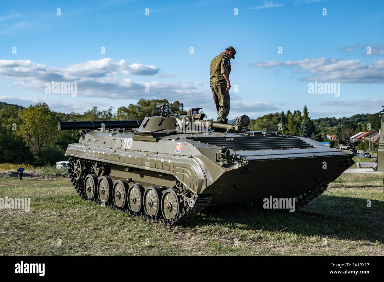 Driver on Slovak armored fighting vehicle BMP-1 during the historical ...