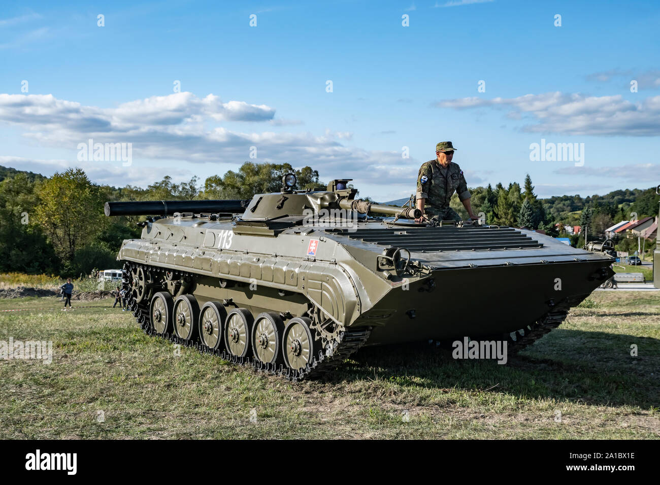 Driver on Slovak armored fighting vehicle BMP-1 during the historical ...