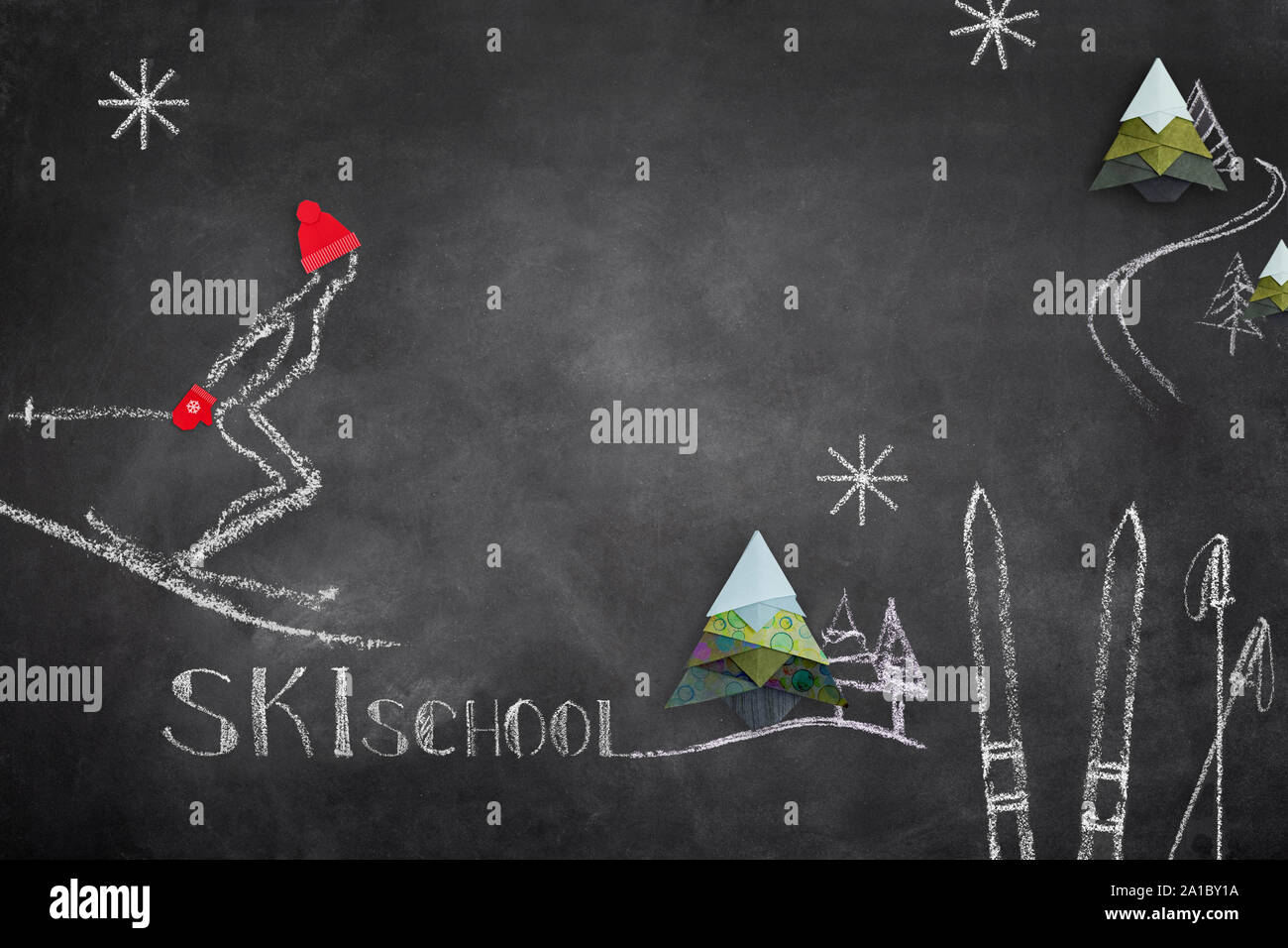 Skiing school chalk text and skier origami Stock Photo - Alamy