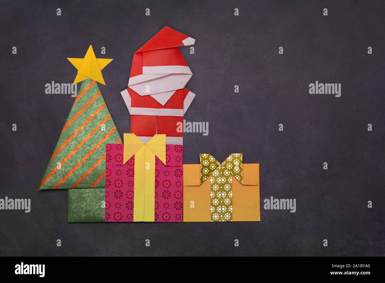 Origami Christmas tree with gift boxes and Santa Claus Stock Photo - Alamy