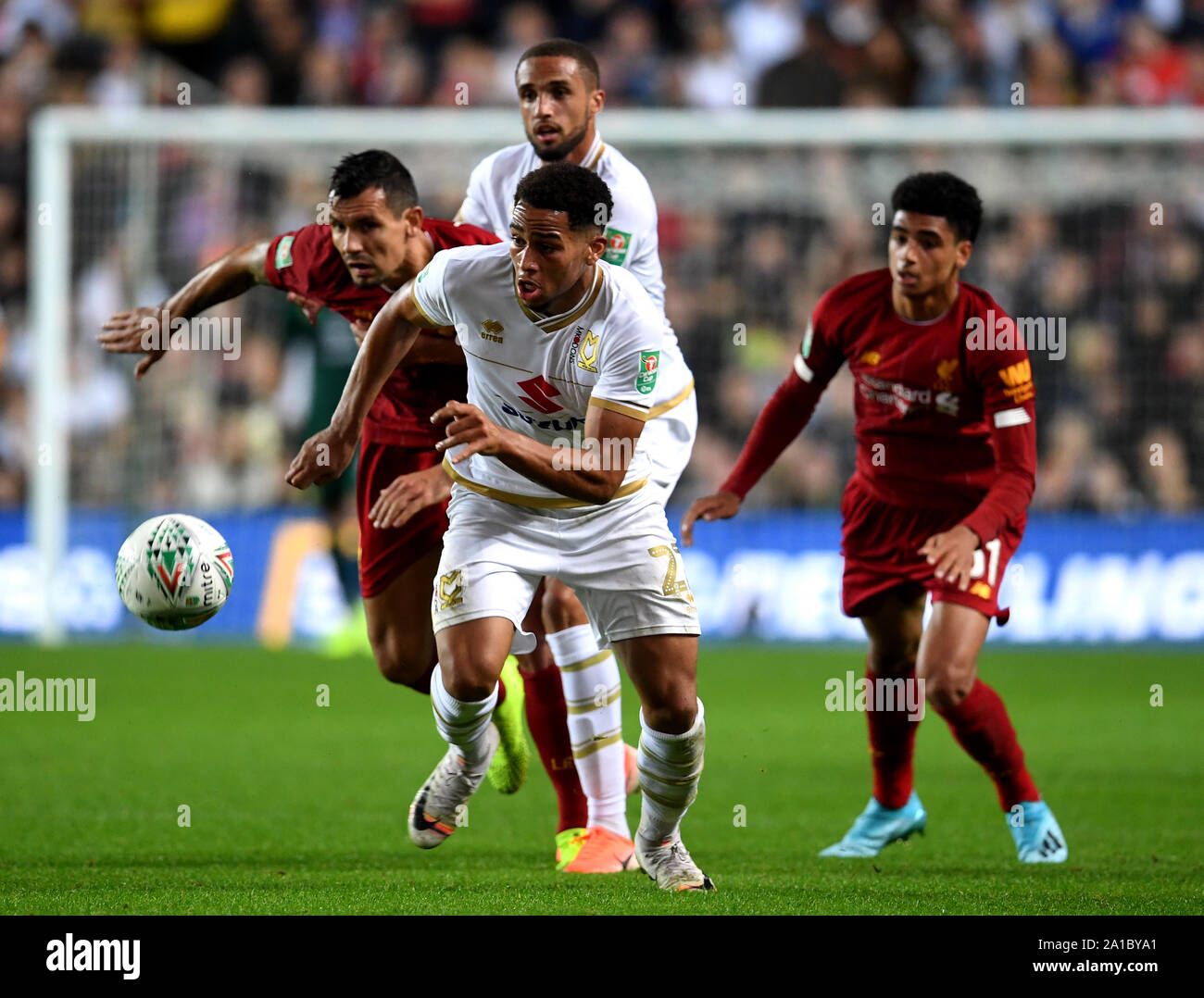 MK Dons' Sam Nombe (centre) in action during the Carabao Cup, Third ...