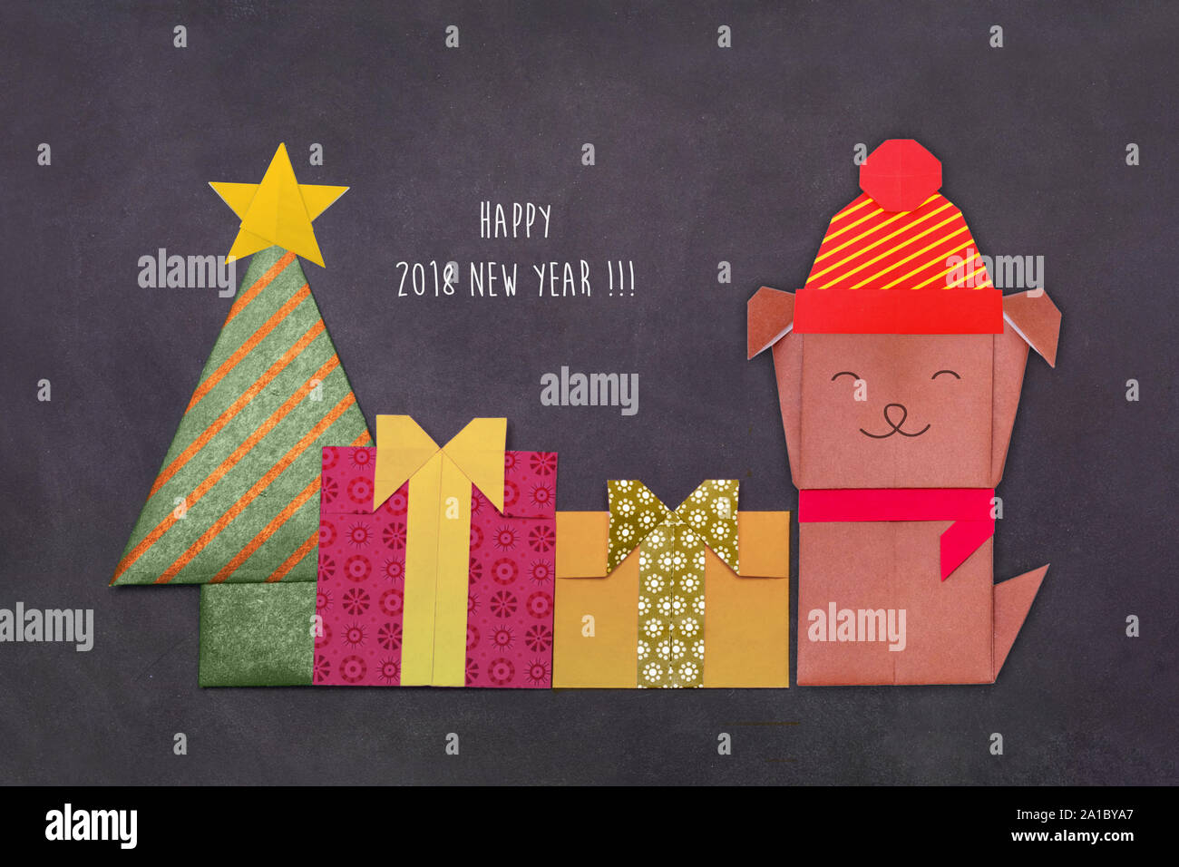 Origami Christmas tree with gift boxes and dog Stock Photo - Alamy