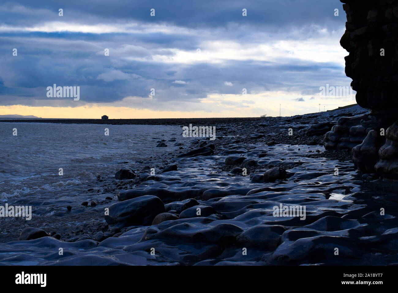 Blue Rocky beach in winter Stock Photo - Alamy