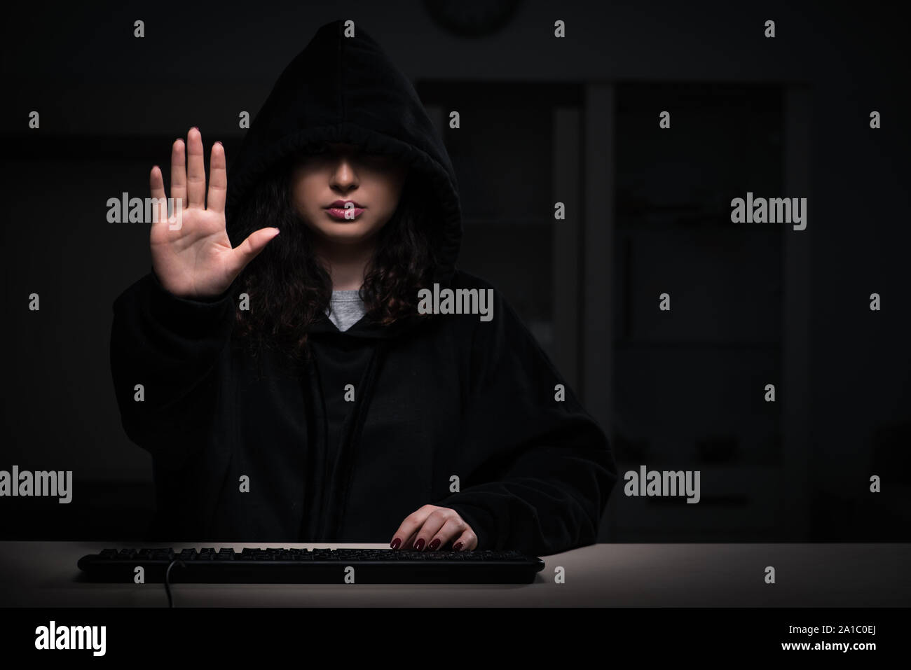 The female hacker hacking security firewall late in office Stock Photo ...