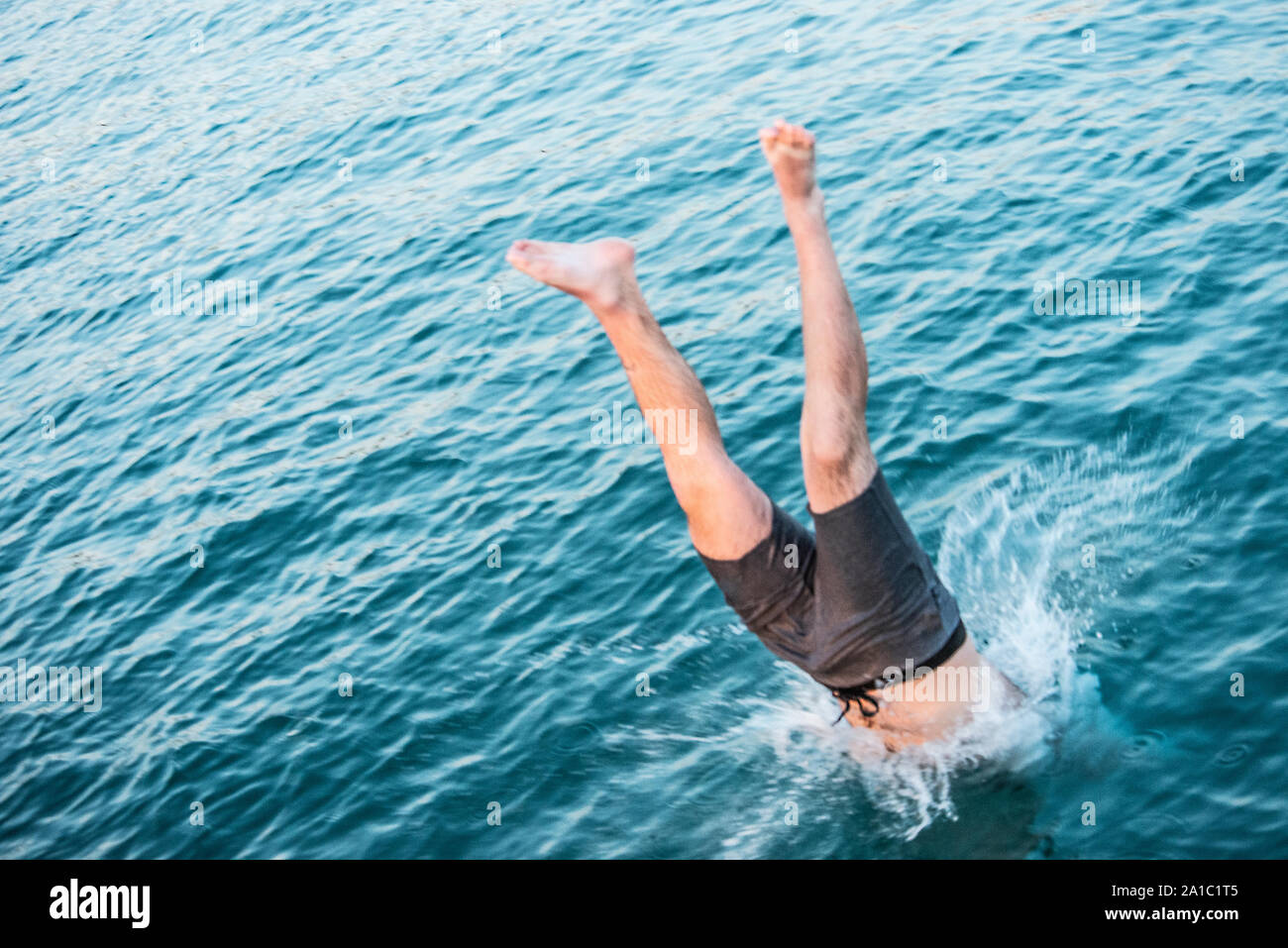 guy dives into the water Stock Photo - Alamy