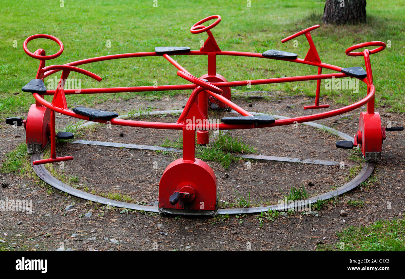 a ring with red toy bicycles in metal at the playground at Grubbe in ...