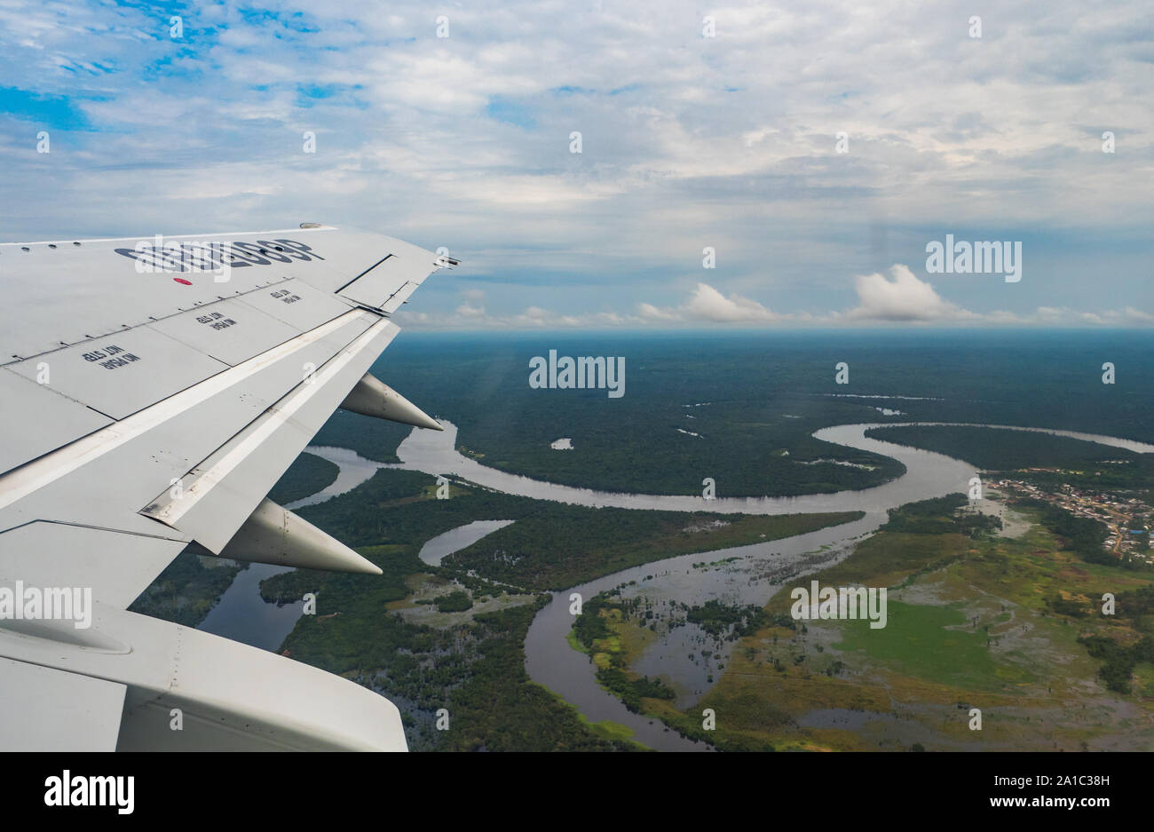 View from airplane window. Wing of an airplane flying above the clouds ...