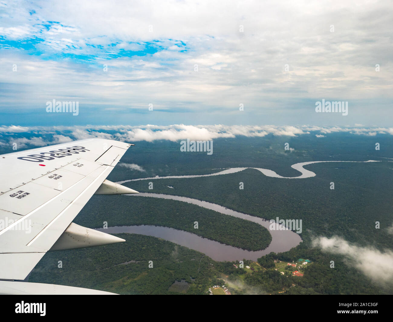 View from airplane window. Wing of an airplane flying above the clouds ...