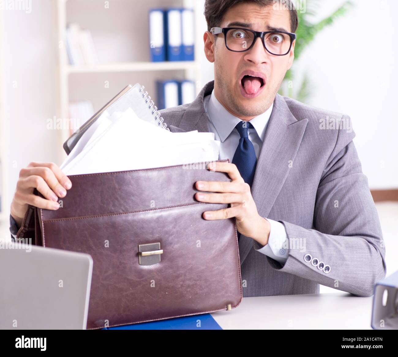 The employee with too much work taking it home Stock Photo - Alamy