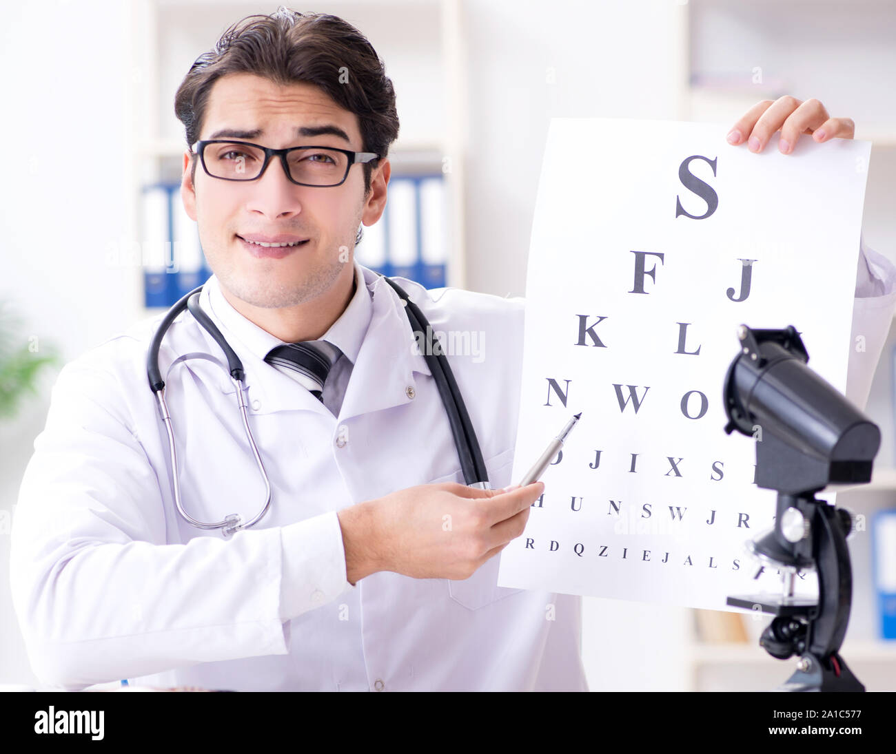 The eye doctor in medical concept Stock Photo - Alamy