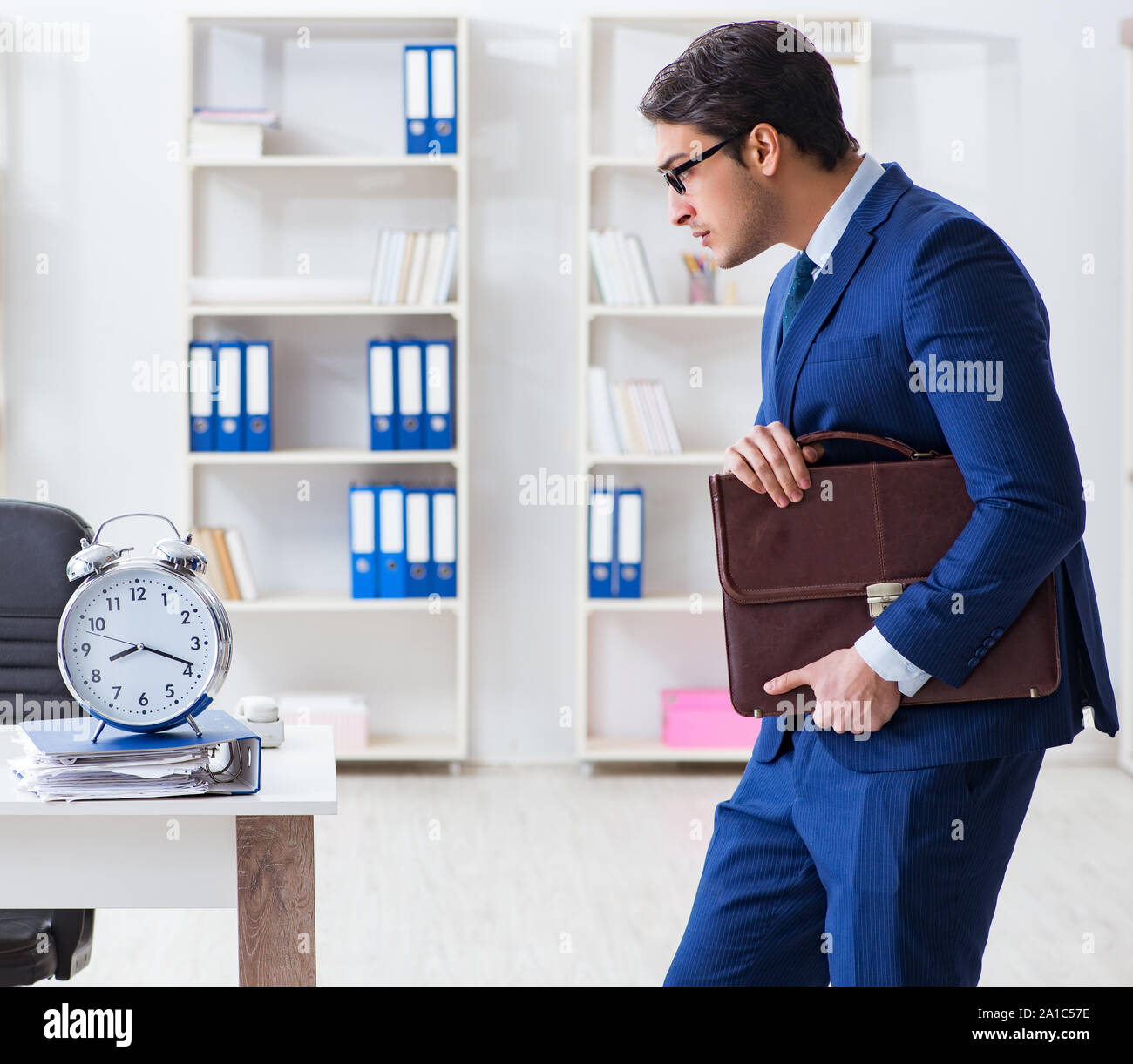 The businessman in bad time management concept Stock Photo - Alamy