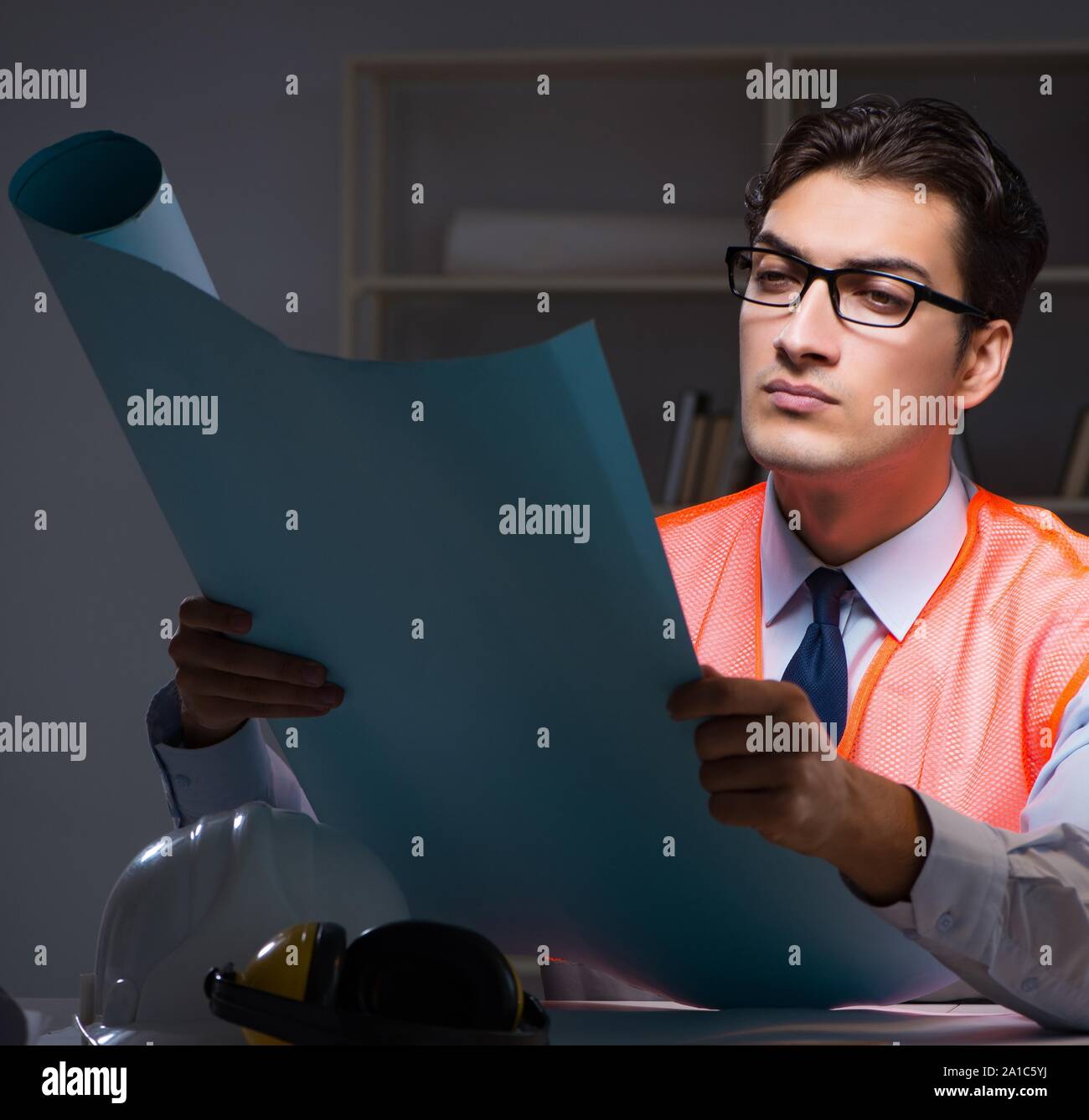 The construction architect working on drawings late at night Stock ...