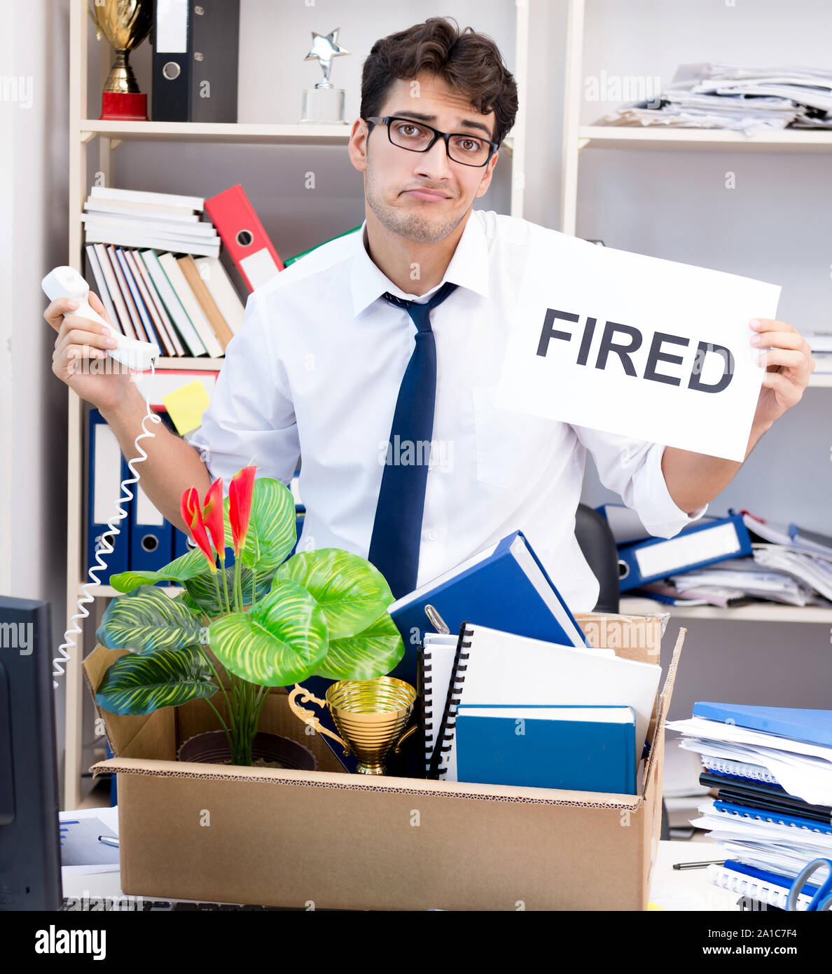 The employee being fired from work made redundant Stock Photo - Alamy