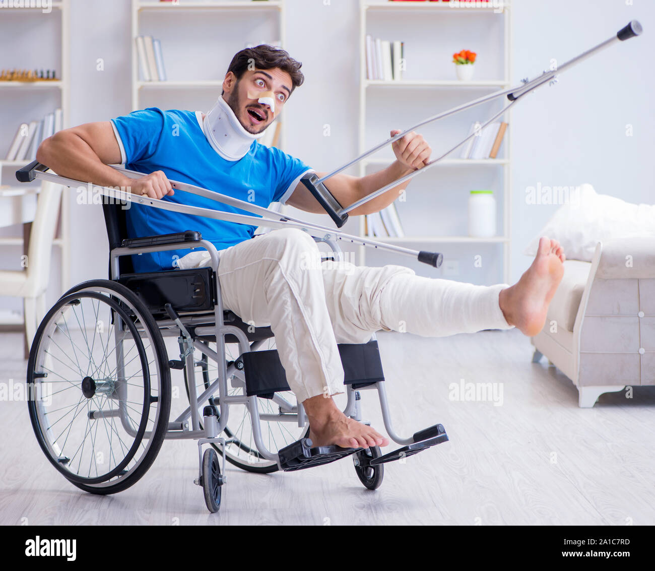 The injured young man recovering at home Stock Photo - Alamy