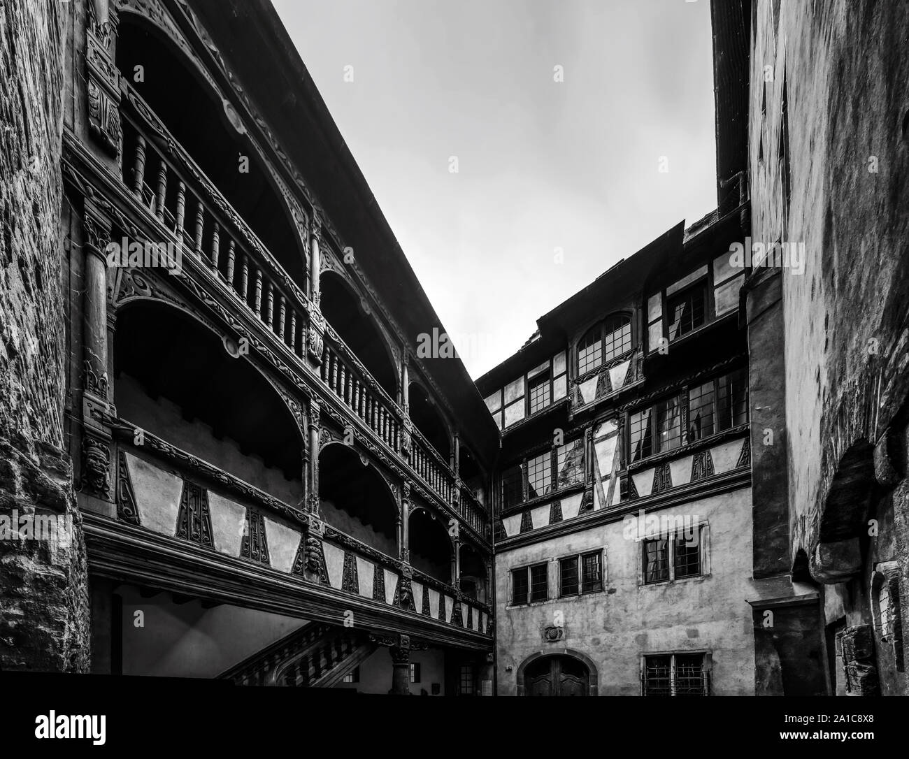 Ancient patio with wooden staircase in old timber-framing rich house XV ...
