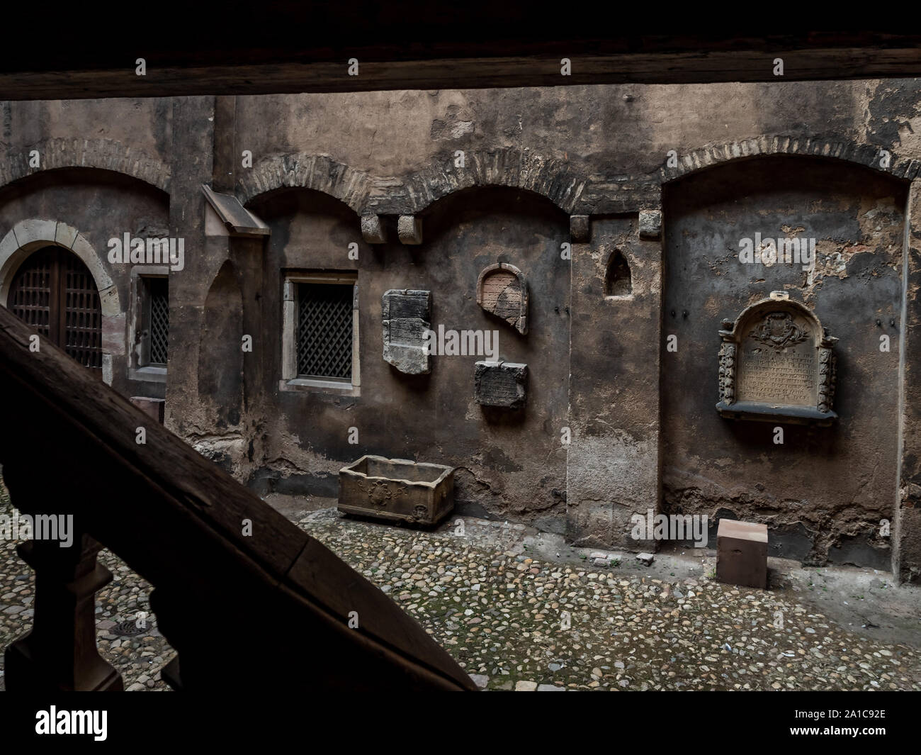 Ancient patio with wooden staircase in old timber-framing rich house XV ...