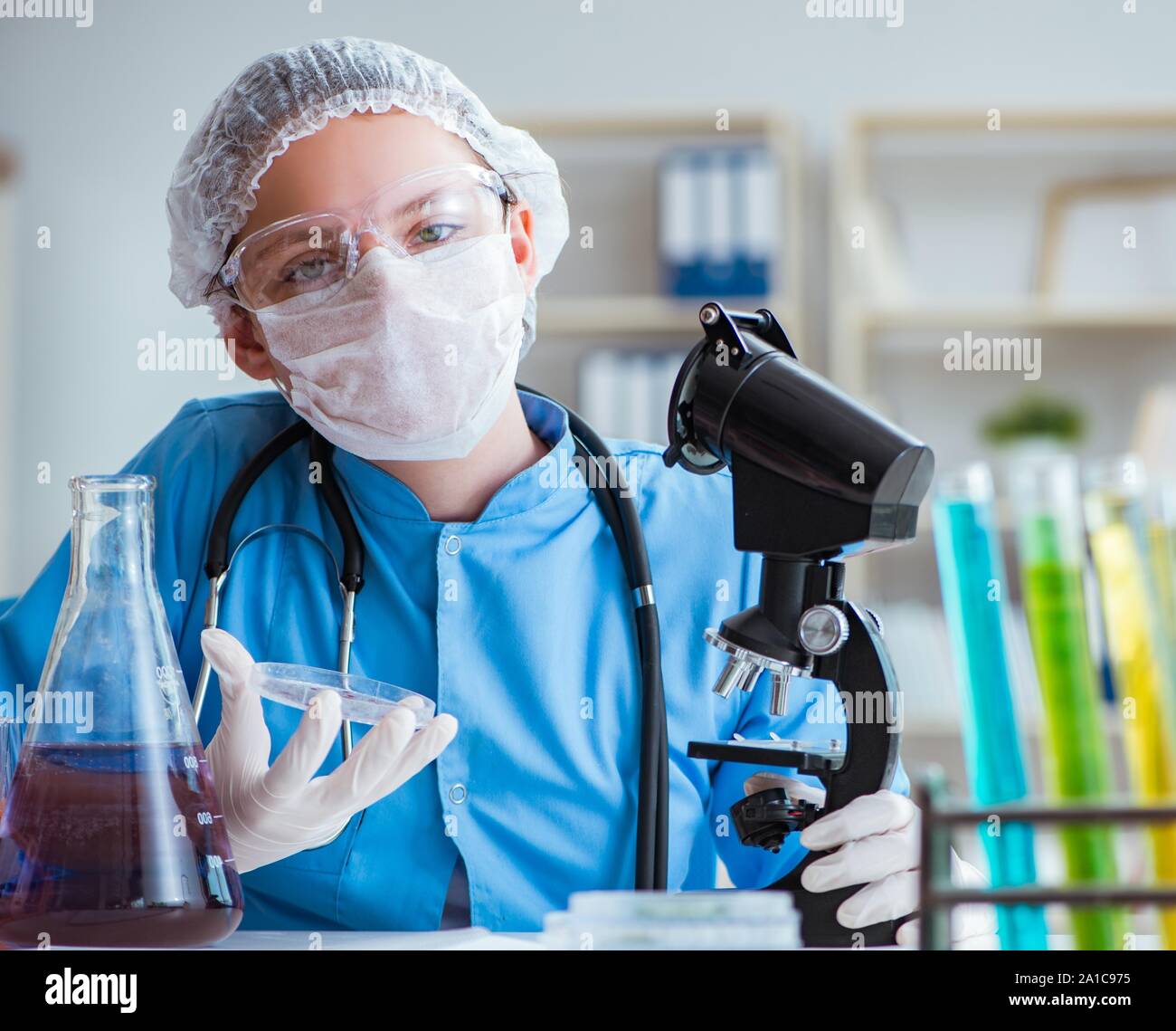 The female scientist researcher doing experiments in laboratory Stock ...