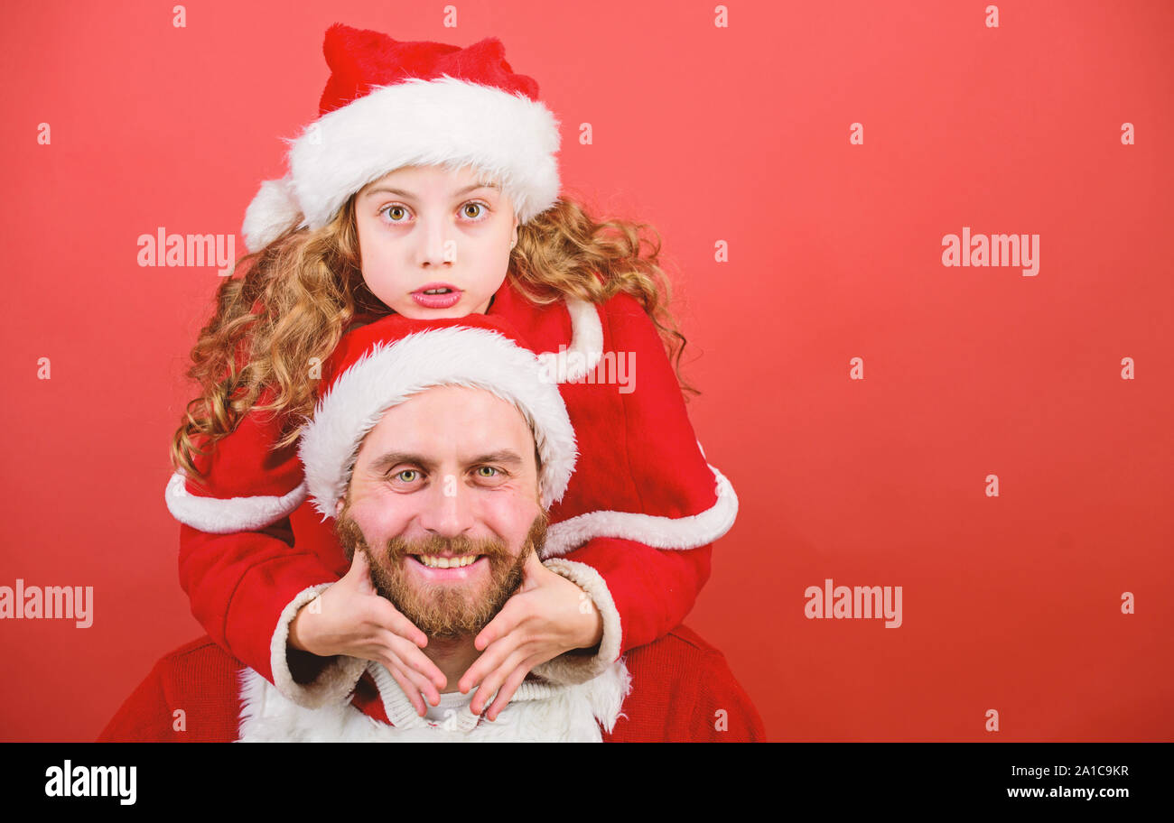 Christmas family tradition. Dad in santa costume and daughter cute kid ...