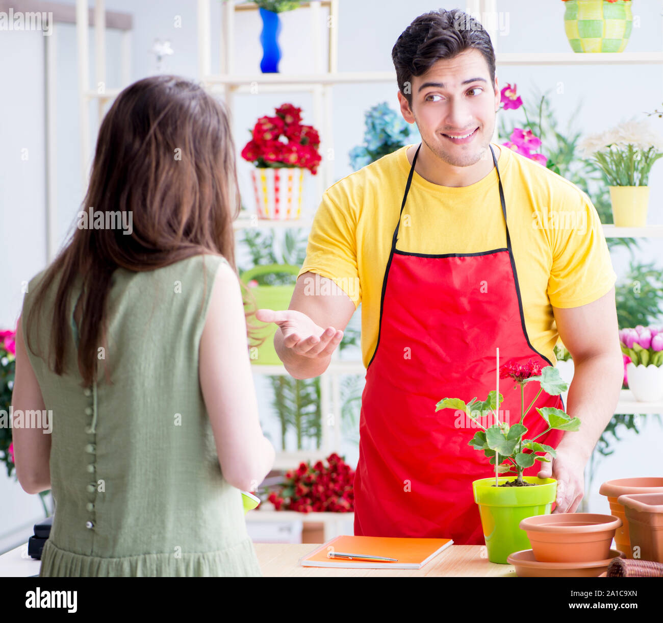 The florist selling flowers in a flower shop Stock Photo - Alamy