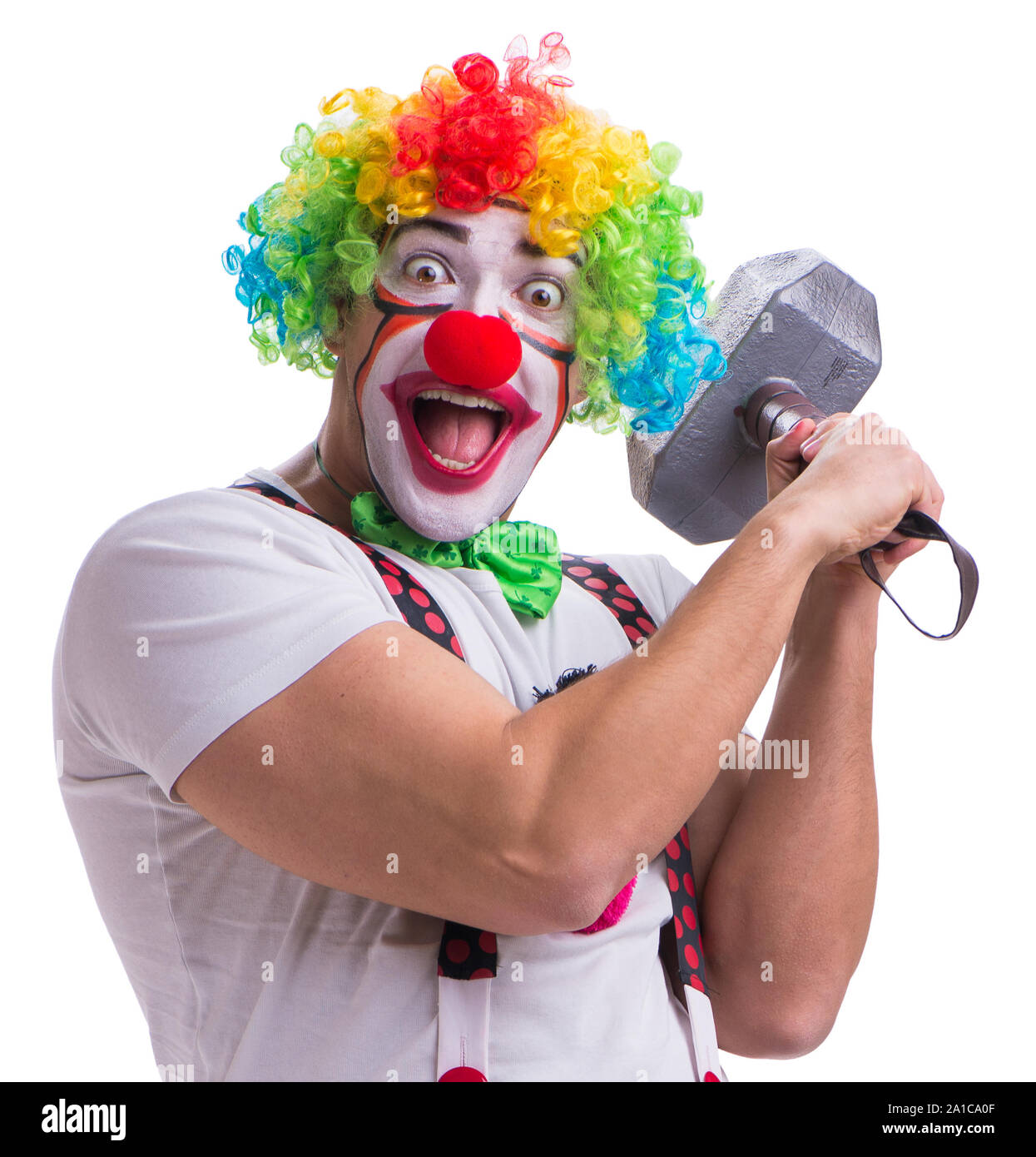 The funny clown with a hammer isolated on white background Stock Photo ...