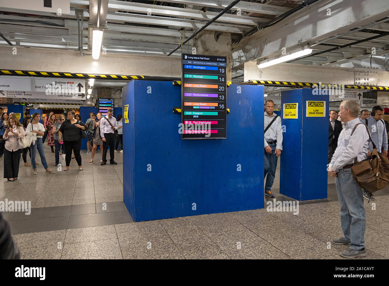 Rush hour commuters wait for trains at the under construction LIRR area ...