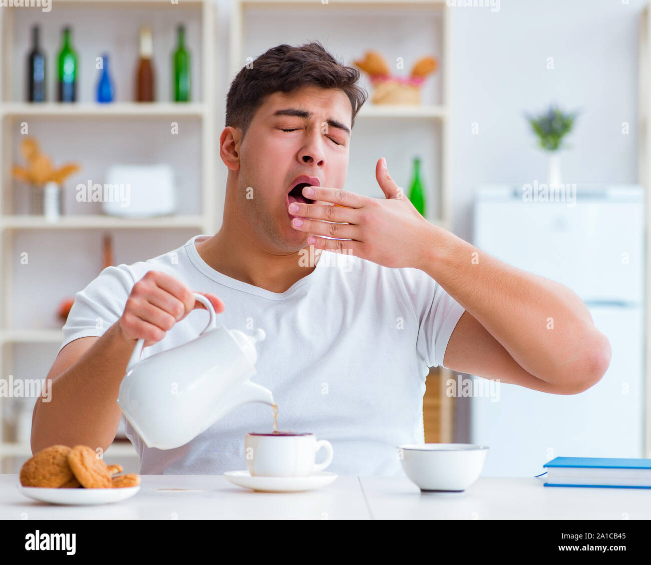 The man falling asleep during his breakfast after overtime work Stock ...