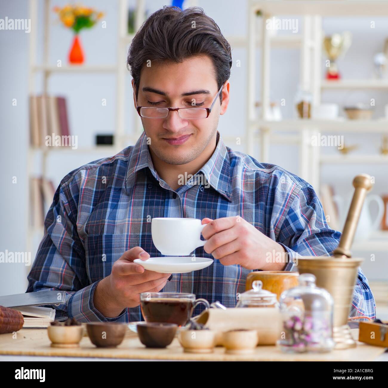 Tea expert brewing cup of drink hi-res stock photography and images - Alamy