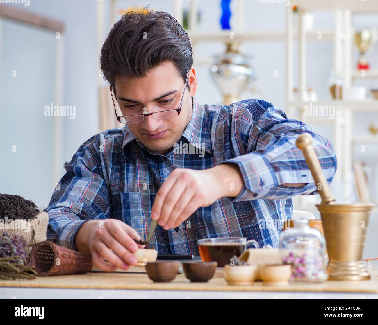 The professional tea expert trying new brews Stock Photo - Alamy