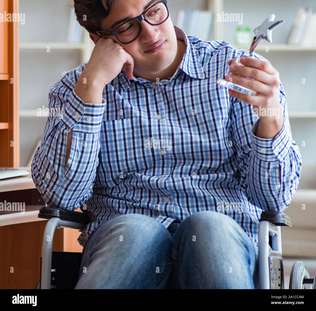 The disabled student studying at home on wheelchair Stock Photo - Alamy