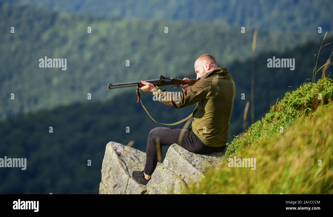 concentrated man ready to fire. hunter hobby. military male in ...