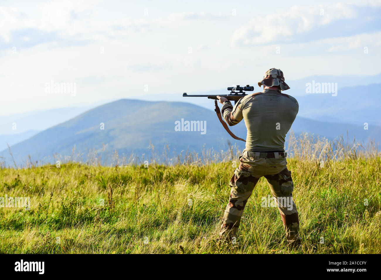 Nice shot. Rifle for hunting. Hunter hold rifle. Hunter mountains ...