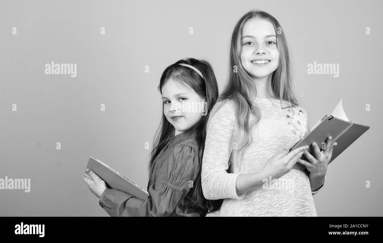 happy little children ready for school lesson. small girls with note ...