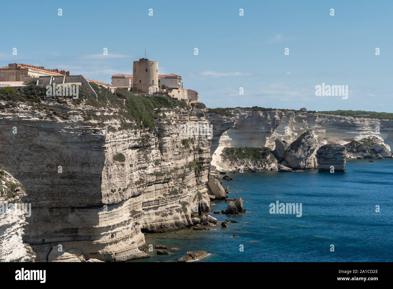 Panoramic view of the high vertical cliffs and the sea. On the rock ...