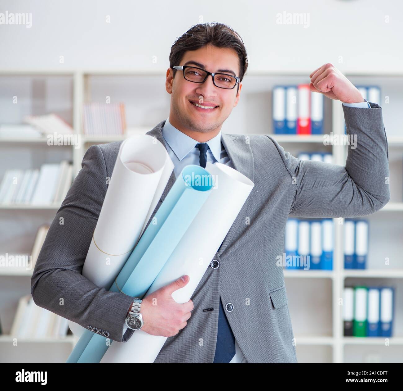 The businessman engineer draftsman with blueprints drawings Stock Photo ...