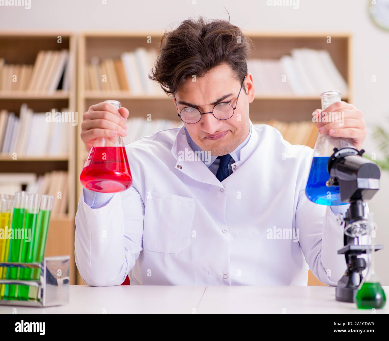 The mad crazy scientist doctor doing experiments in a laboratory Stock ...