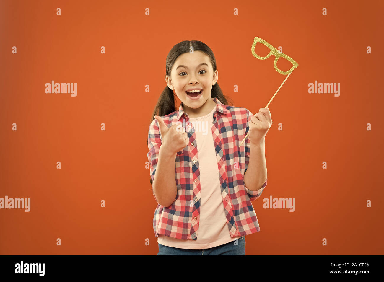 Perfect props for celebrating. Happy little child showing thumbs up ...