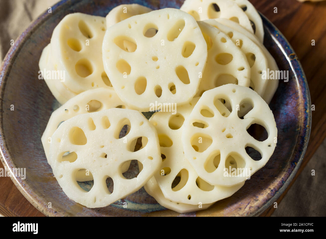 Raw Organic White Lotus Root in Slices Stock Photo - Alamy