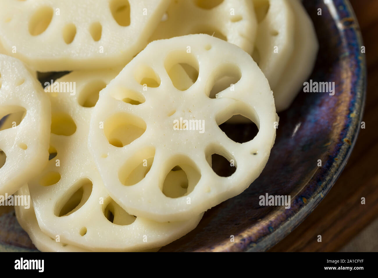 Raw Organic White Lotus Root in Slices Stock Photo - Alamy