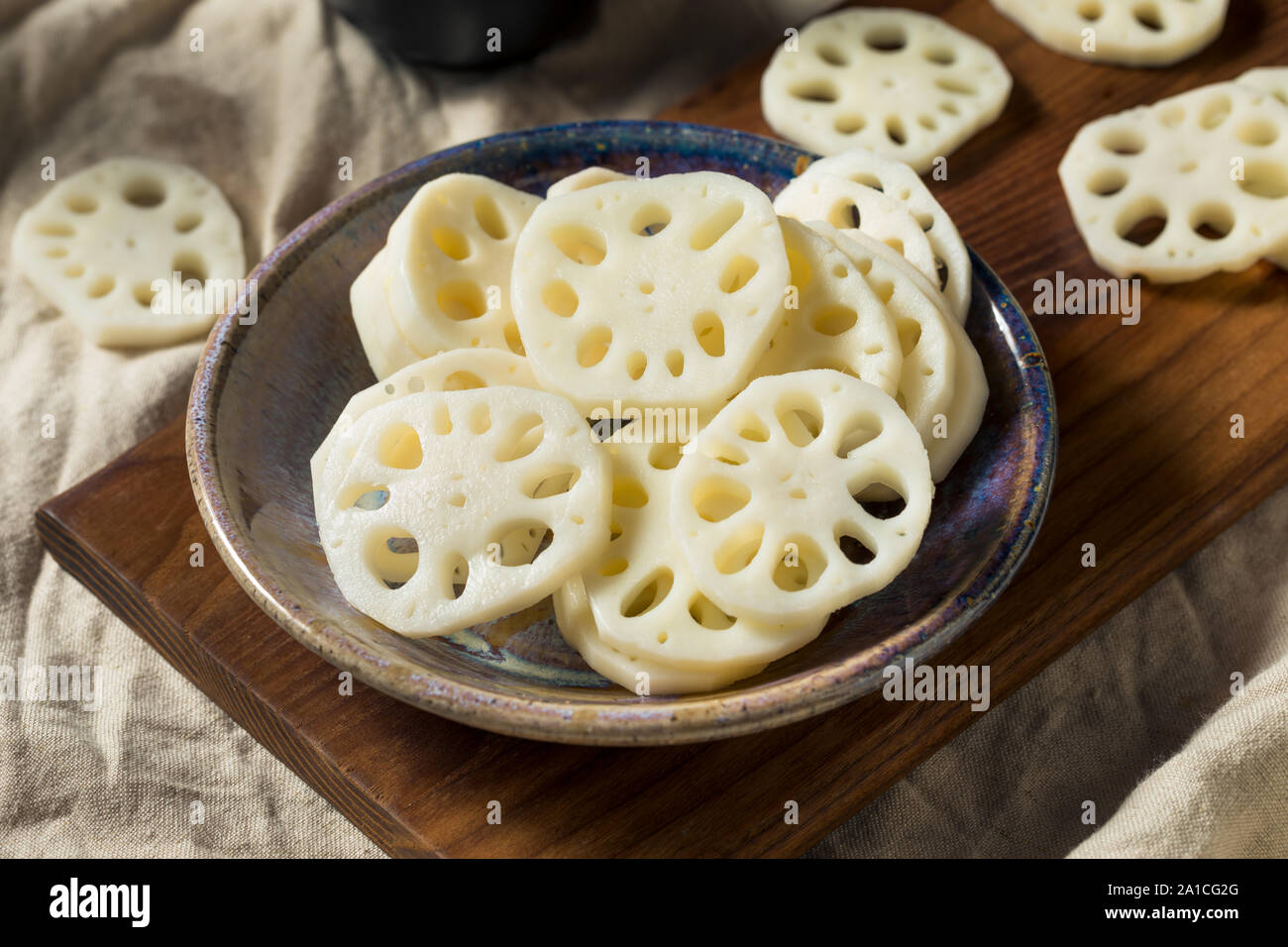 Raw Organic White Lotus Root in Slices Stock Photo - Alamy