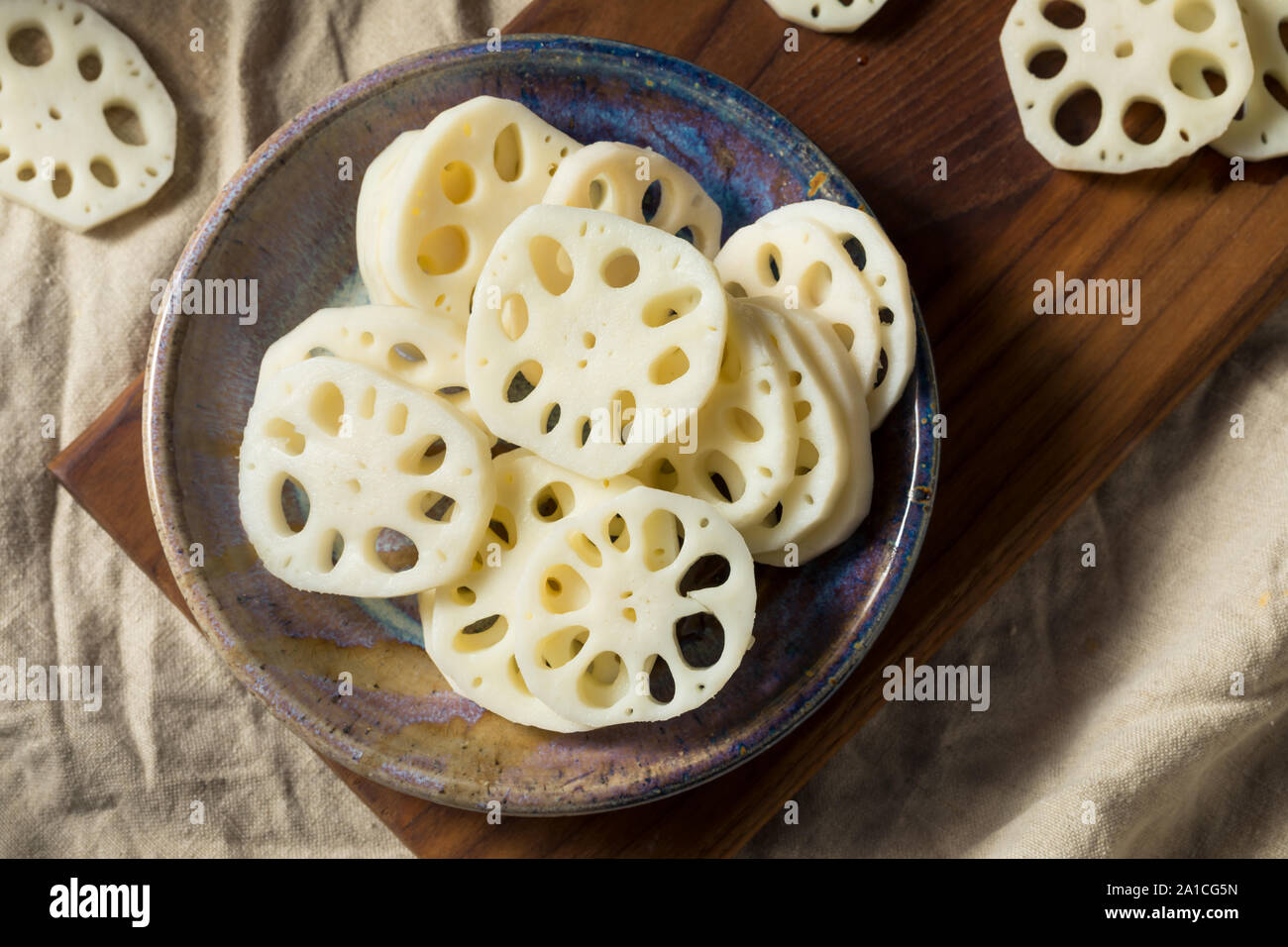 Raw Organic White Lotus Root in Slices Stock Photo - Alamy