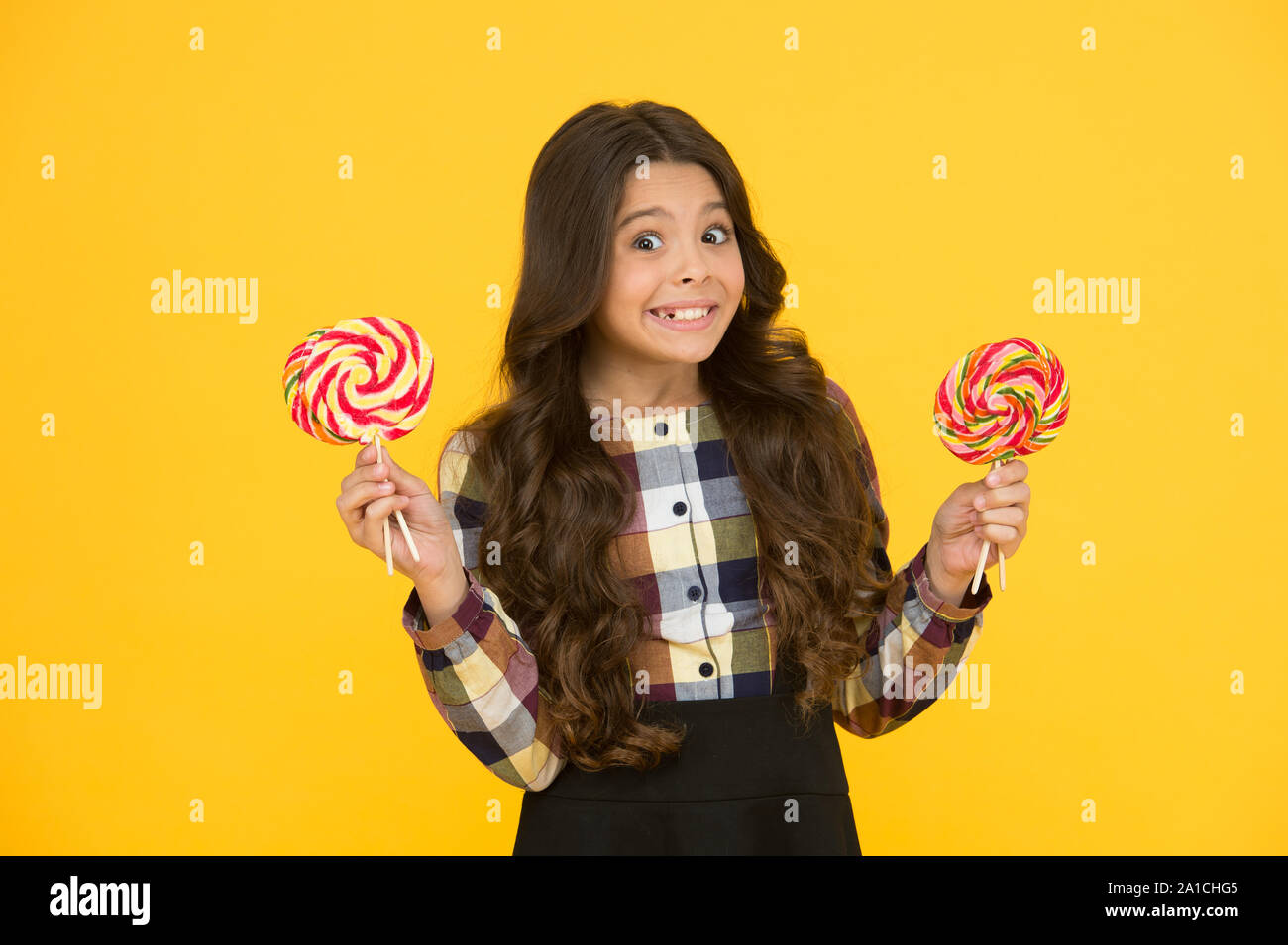 Harmful food. Crazy about sweets. Sugar addiction. Happy kid with sweet ...