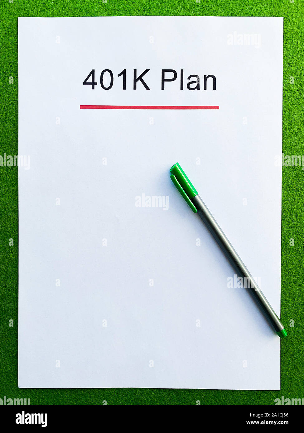 Paper with 401k plan on green background Stock Photo - Alamy