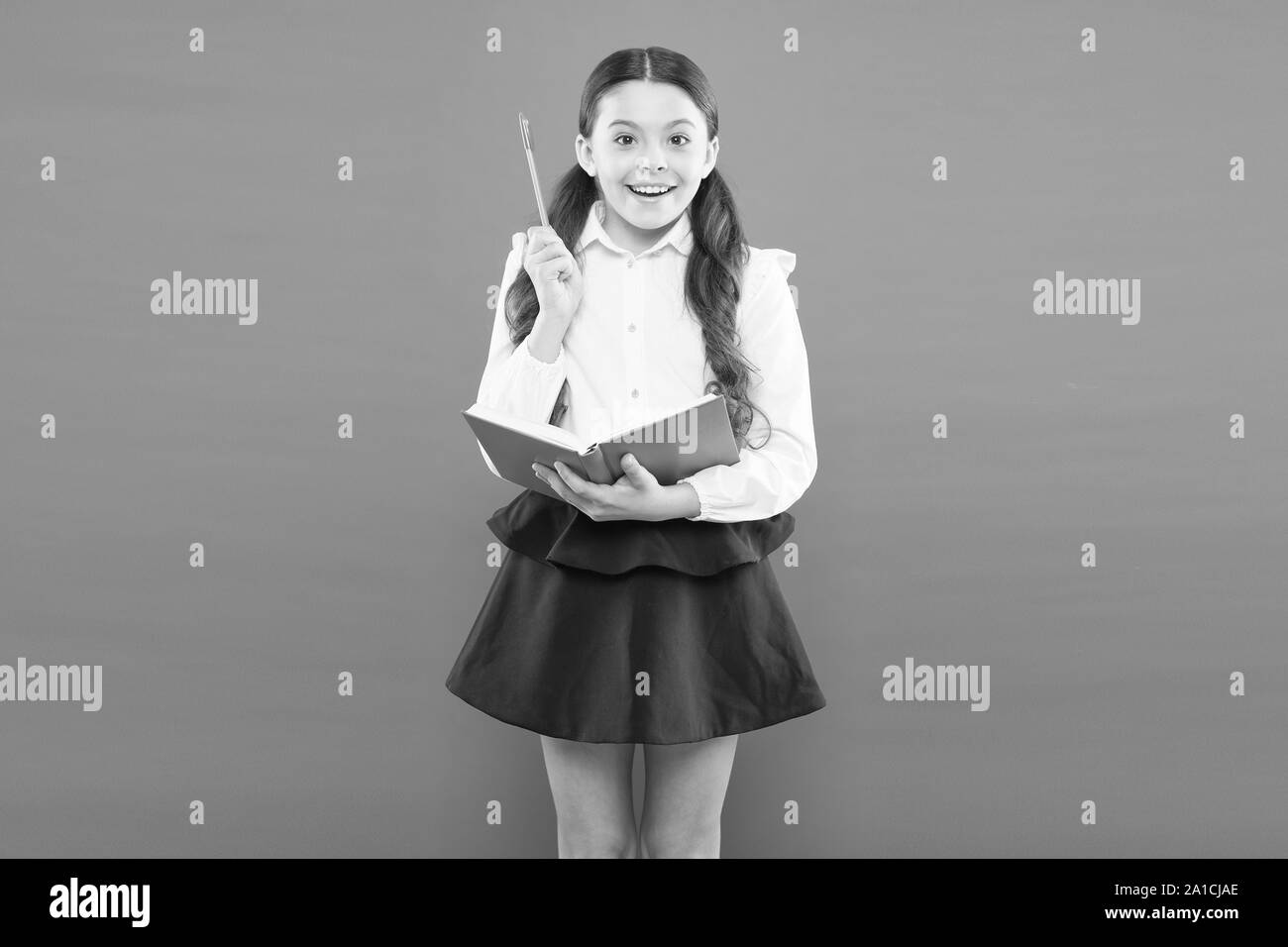 Kid school uniform hold workbook. School lesson. Child doing homework ...