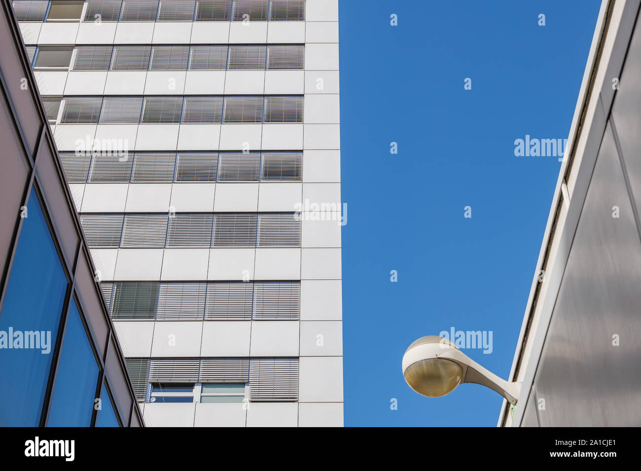 Low angle view of sky between modern building towers with rectangular ...