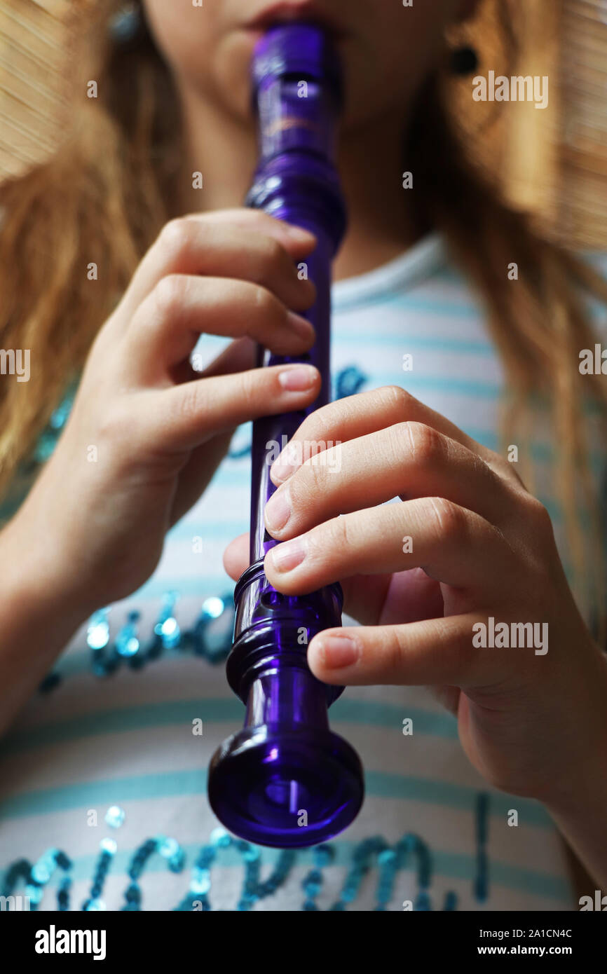 A child playing the recorder Stock Photo - Alamy